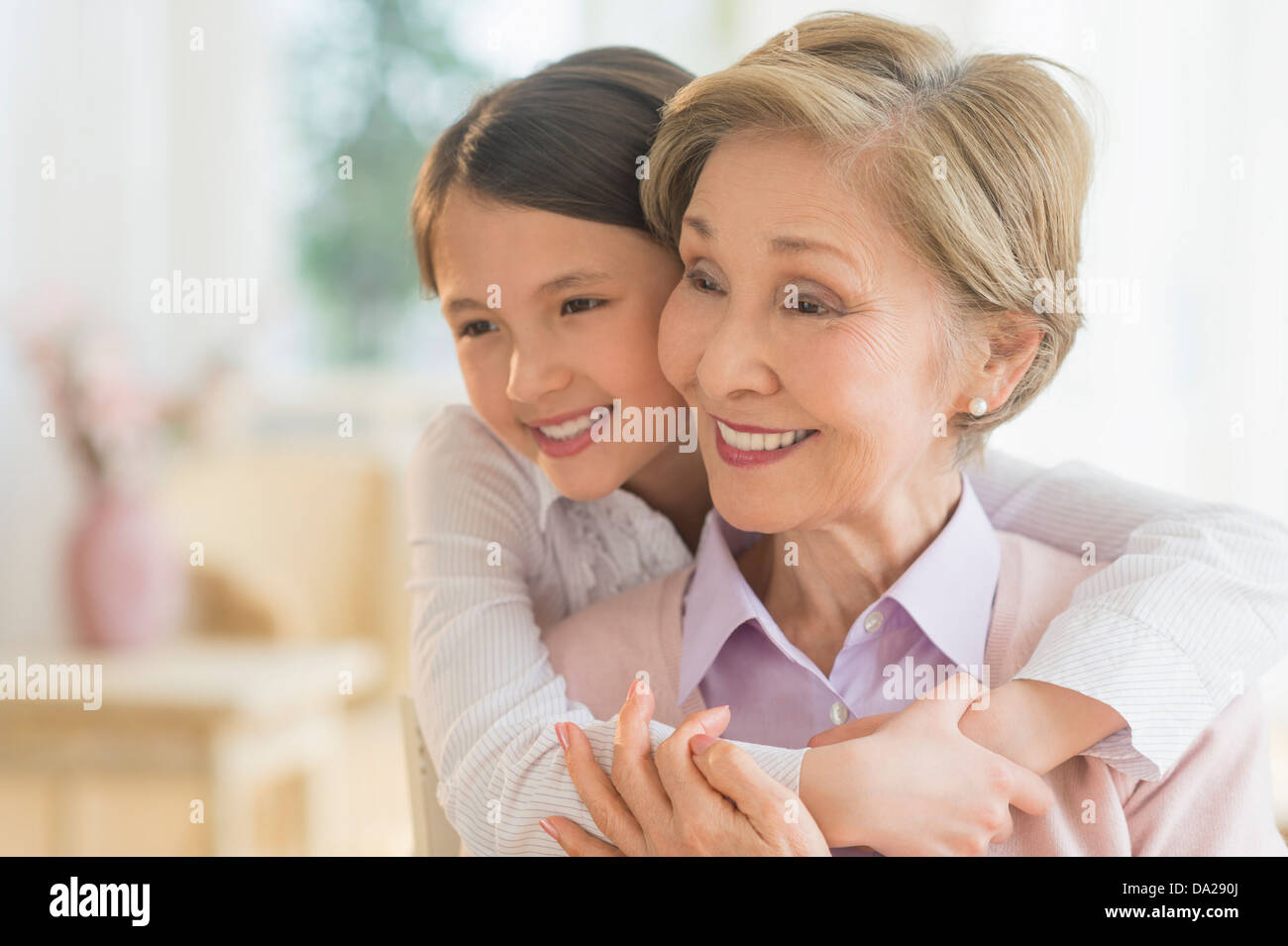 Grandmother and grandchild hugging hi-res stock photography and images ...