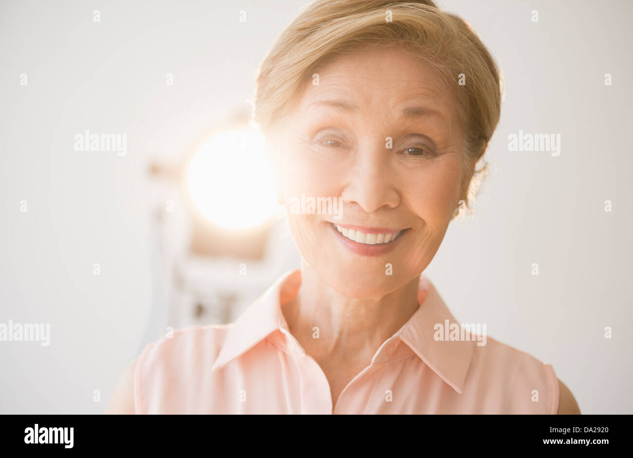 Portrait of senior woman smiling Stock Photo - Alamy