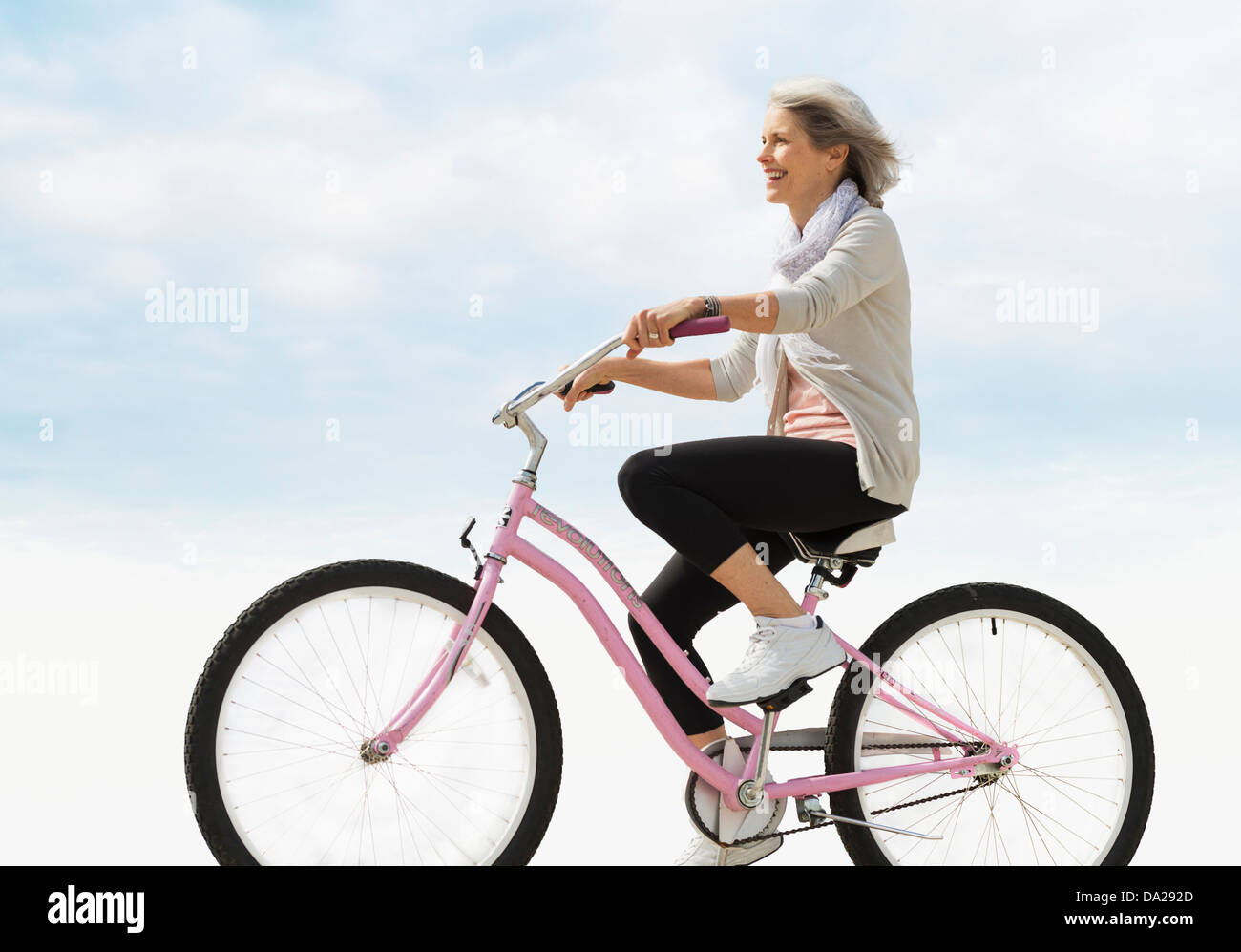 Senior woman riding bicycle Stock Photo - Alamy
