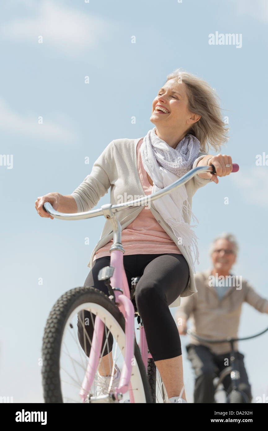 Senior couple riding bicycle Stock Photo - Alamy