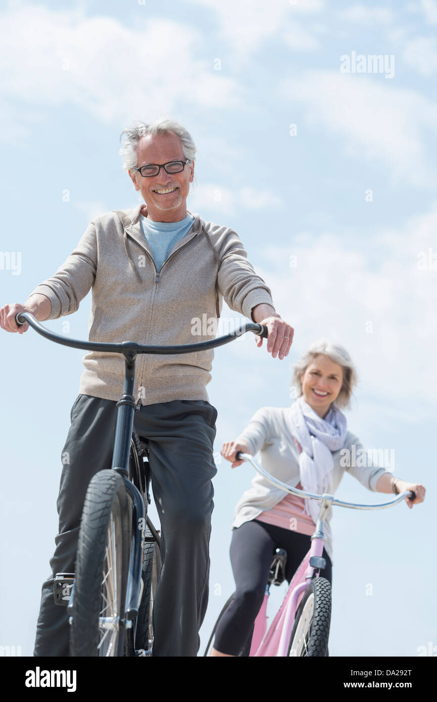 Senior couple riding bicycle Stock Photo - Alamy