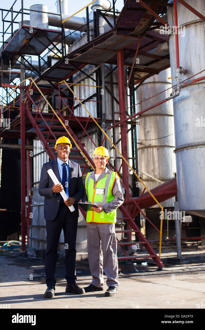 oil and chemical manager standing with factory worker at plant Stock ...