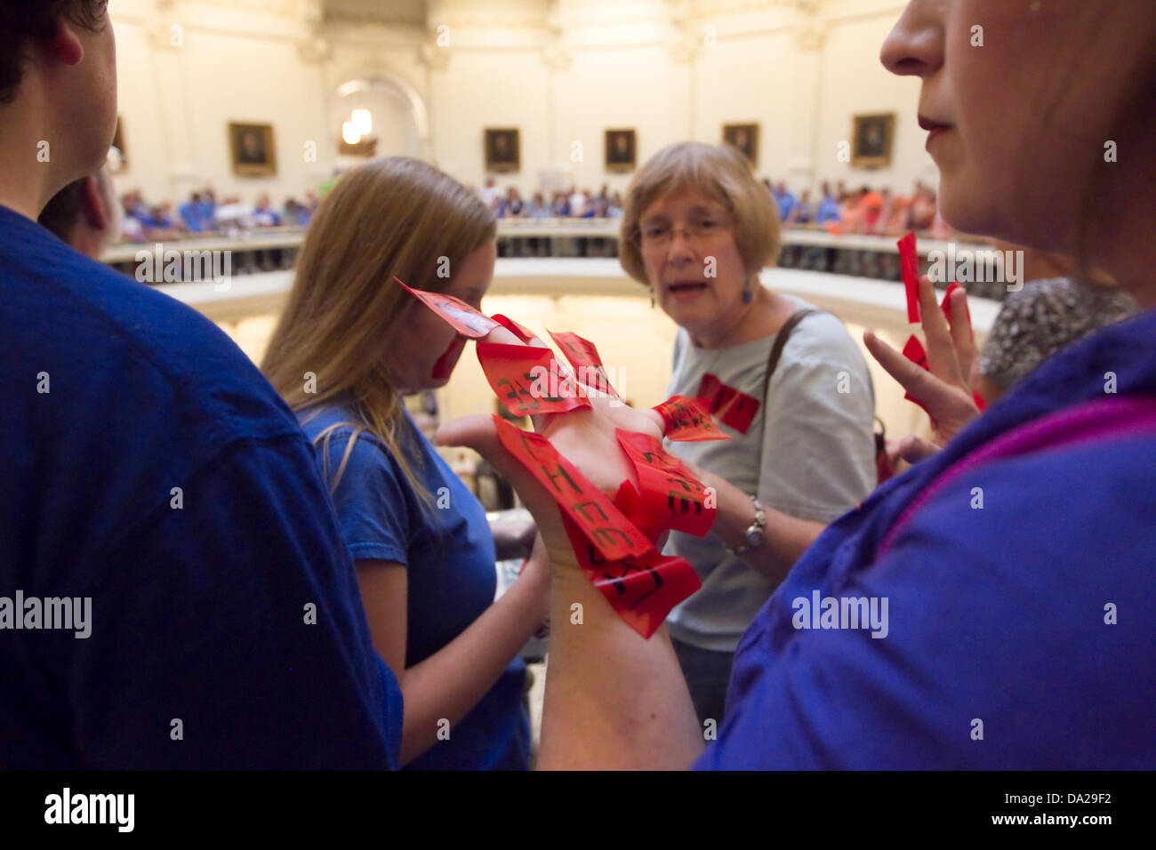 Hundreds of pro-life and pro-choice activists crowd inside the Texas ...
