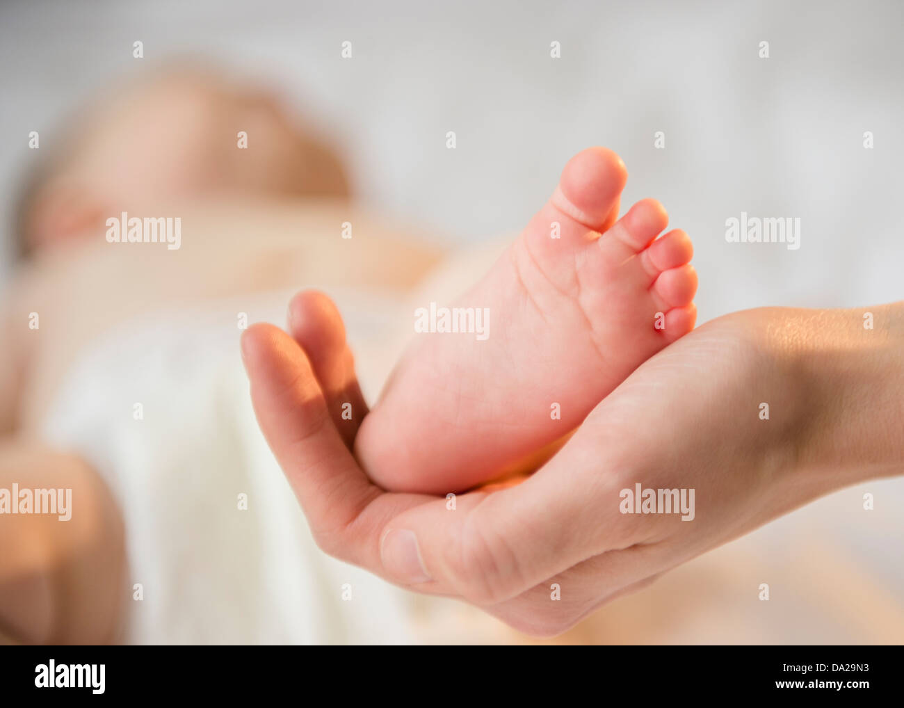 Hand holding foot hi-res stock photography and images - Alamy