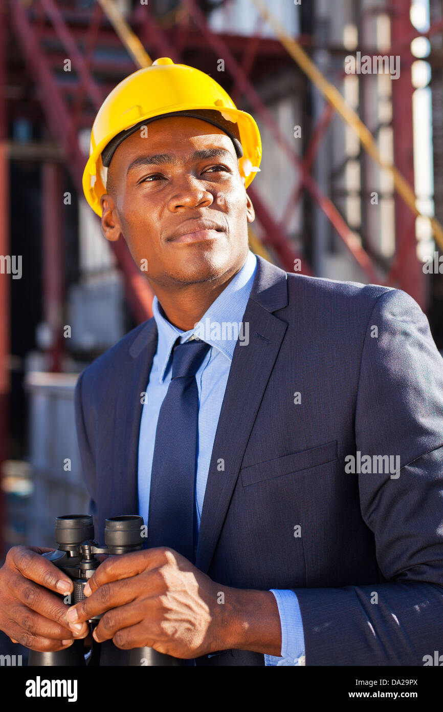 handsome afro american petrochemical businessman with binoculars at ... handsome afro american petrochemical businessman with binoculars at ...