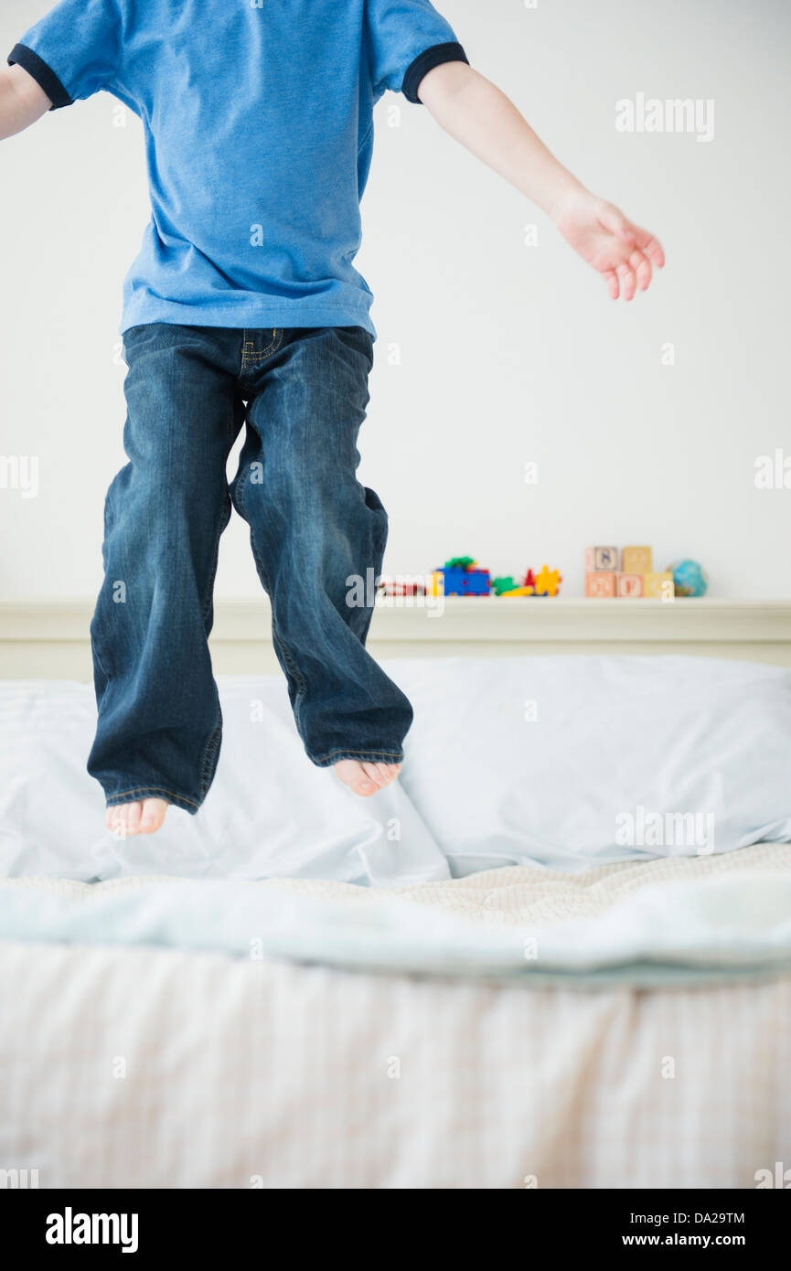 Boy bed jump hi-res stock photography and images - Alamy