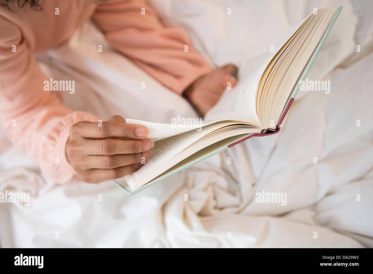 Hands holding book hi-res stock photography and images - Alamy