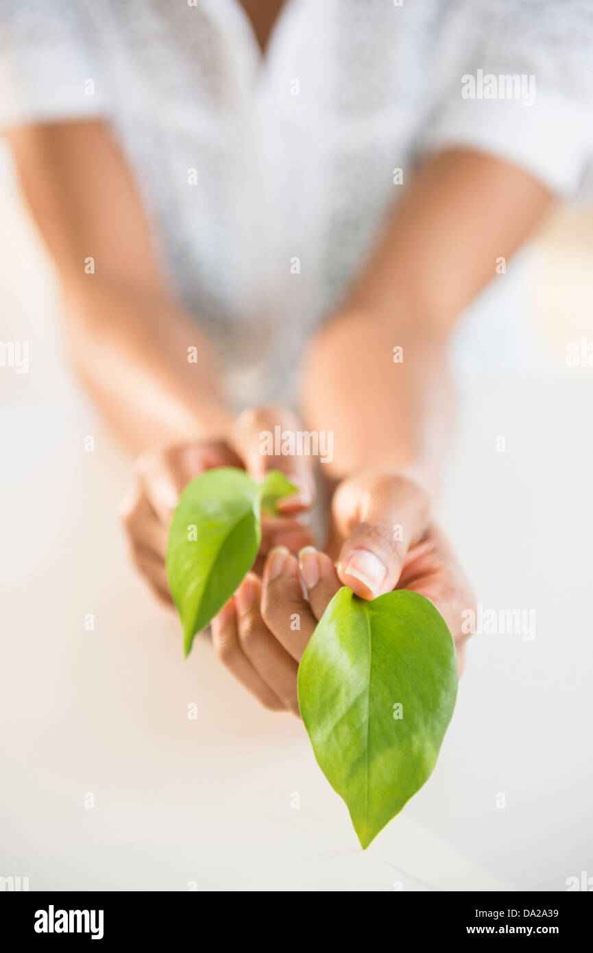 woman with green leaf Stock Photo - Alamy