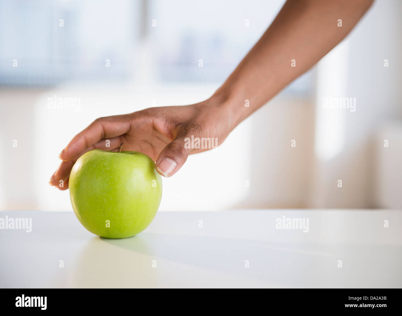 Hand reaching for fruit hi-res stock photography and images - Alamy