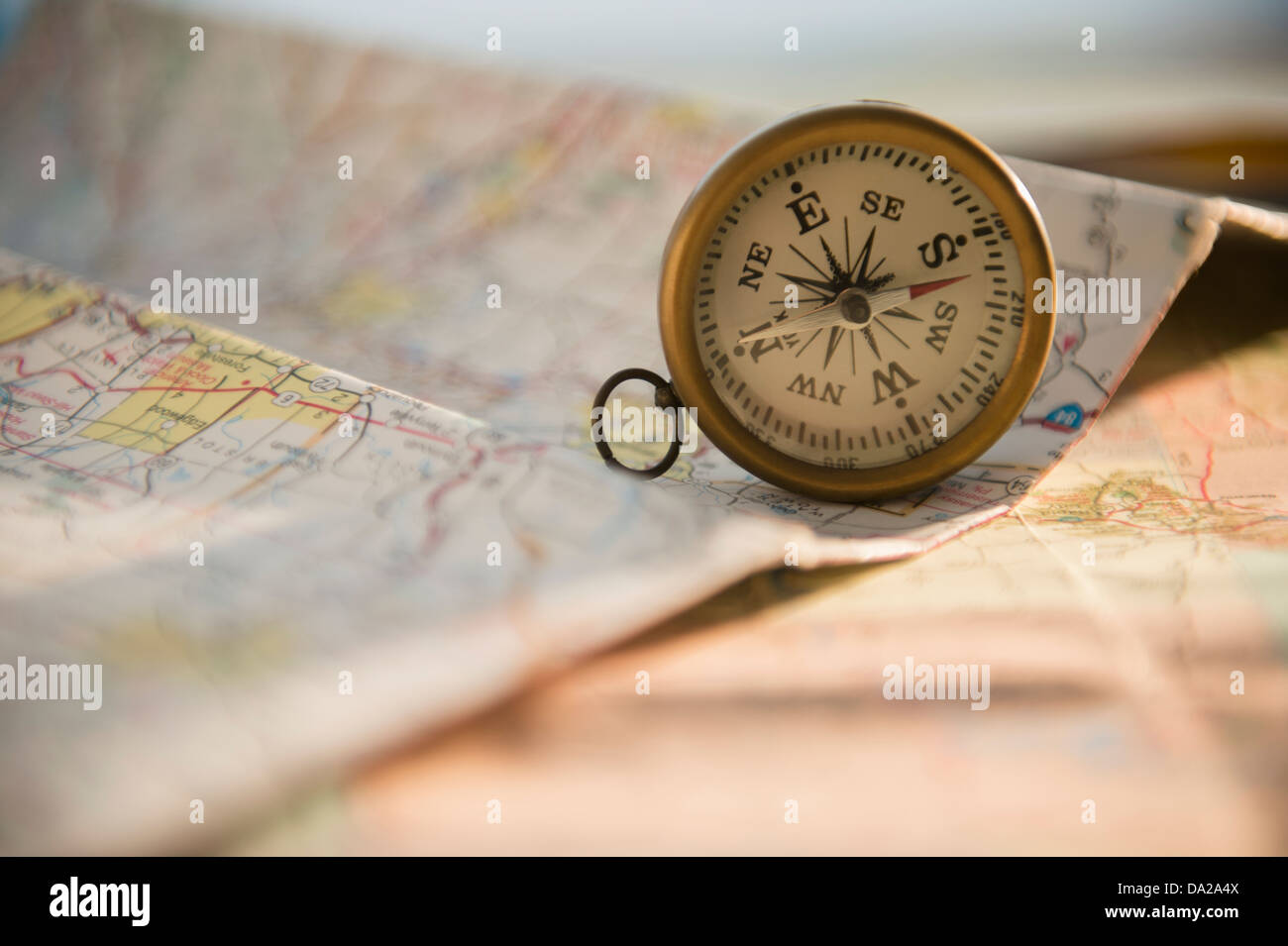 Studio Shot of maps and compass Stock Photo - Alamy