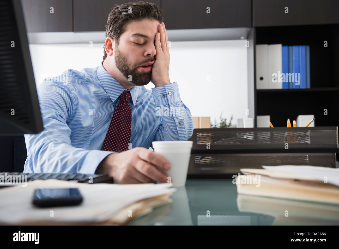Portrait of overworked man Stock Photo - Alamy