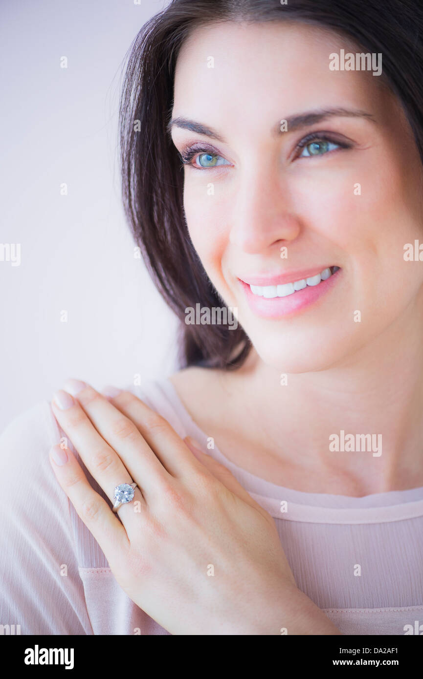Portrait of smiling woman with engagement ring Stock Photo - Alamy