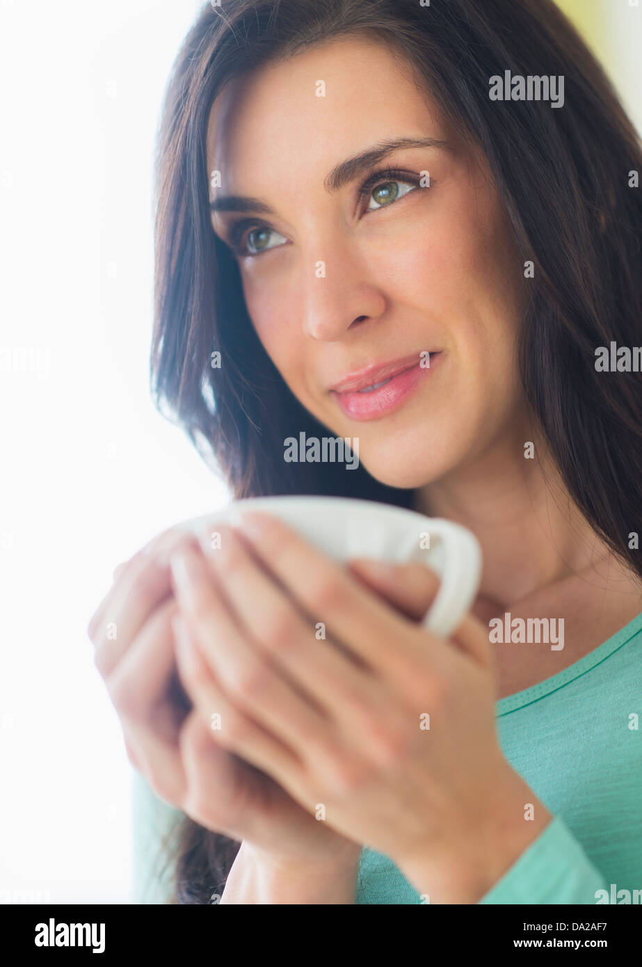 Woman with cup in hand Stock Photo - Alamy