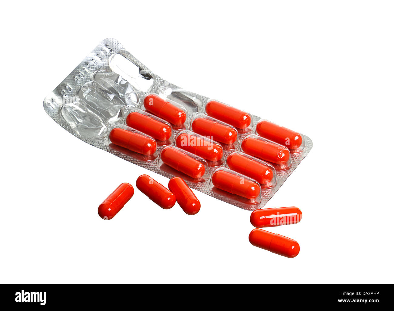 Orange colored medicinal pills or caplets in packaging isolated on ...