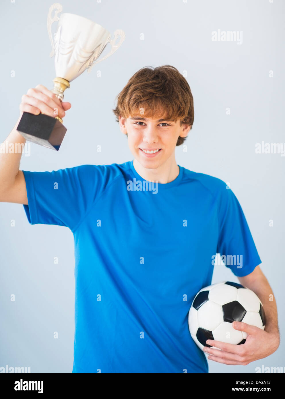 Boy holding trophy hi-res stock photography and images - Alamy