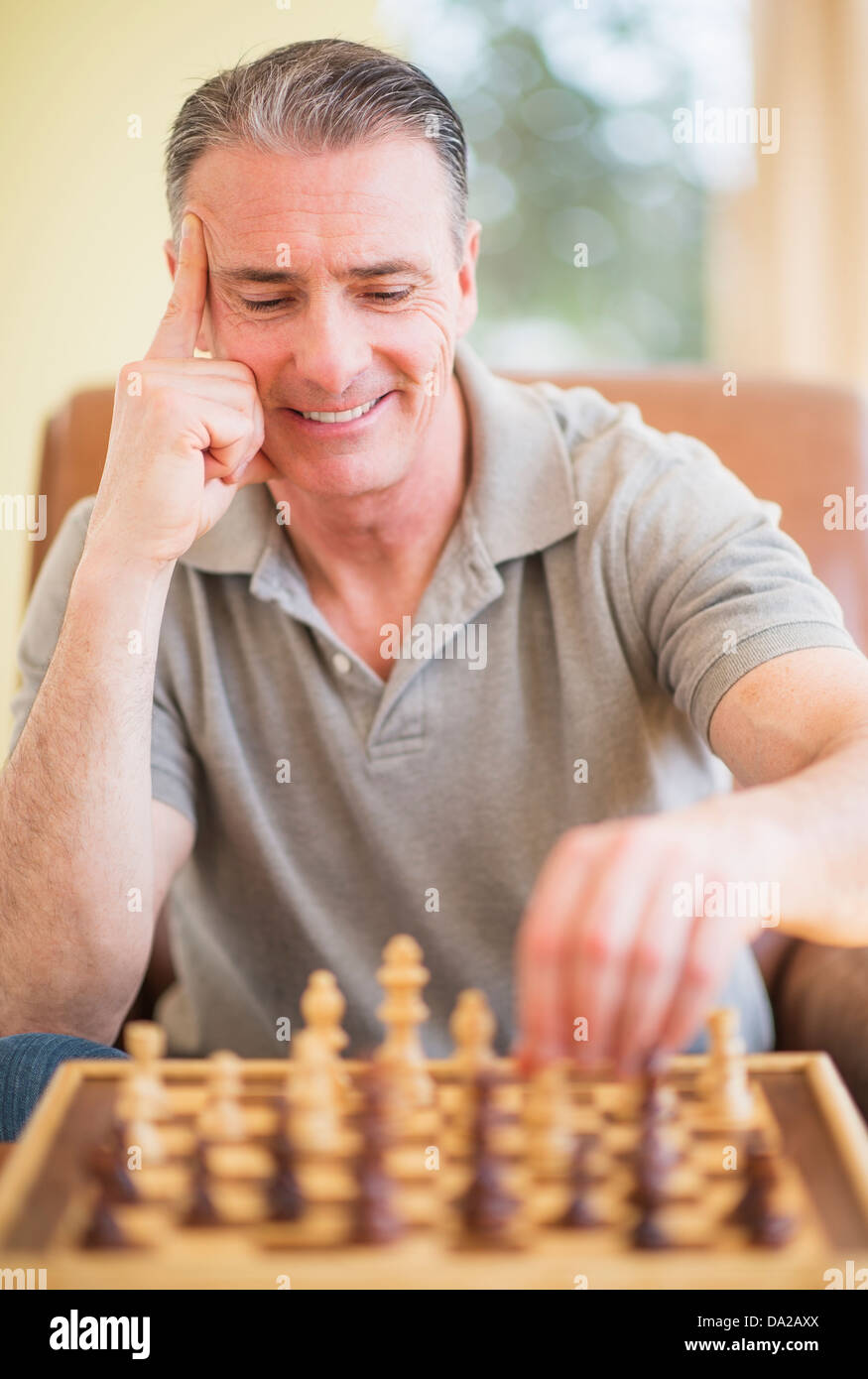 Portrait of man playing chess Stock Photo - Alamy