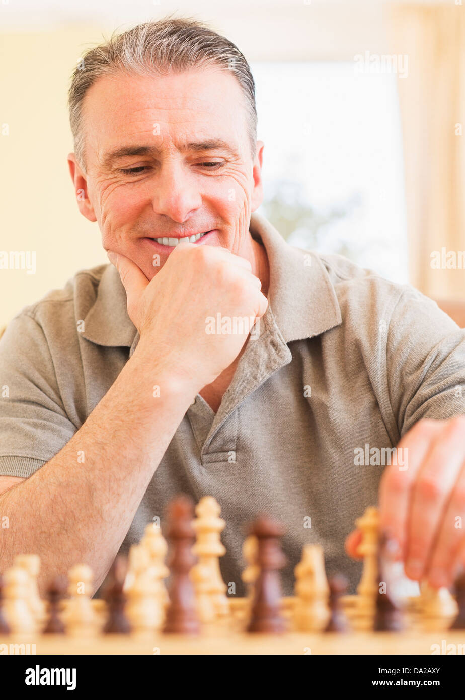Portrait of man playing chess Stock Photo - Alamy
