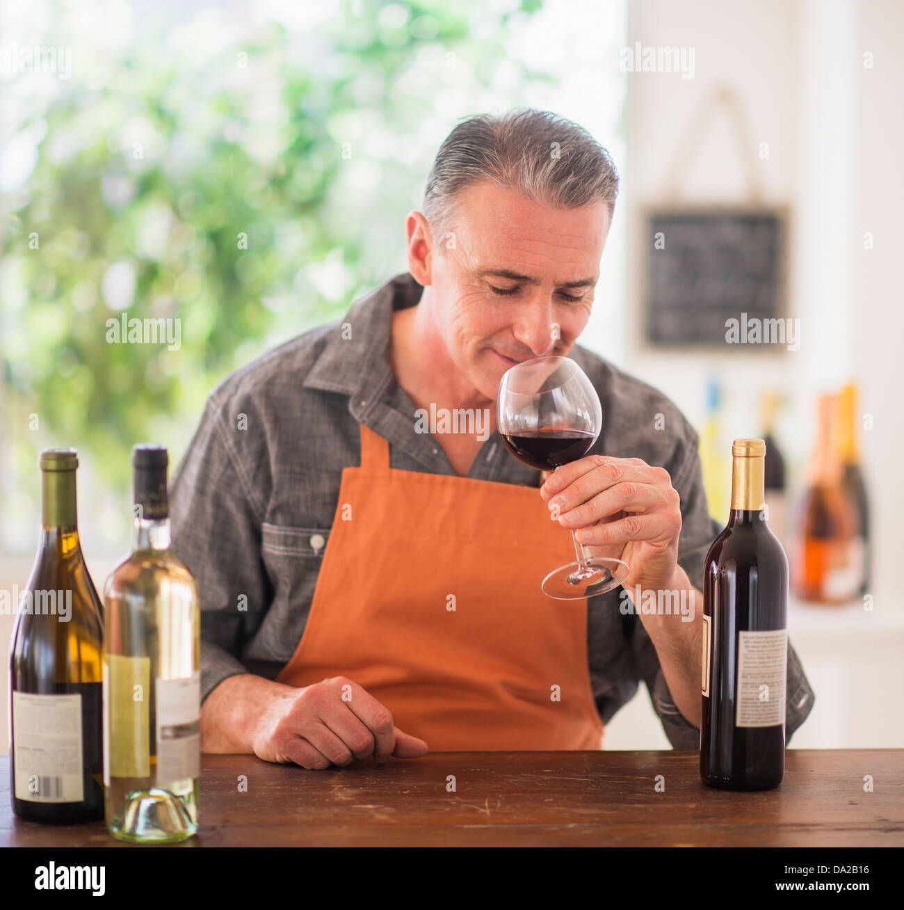 Portrait of man tasting wine Stock Photo - Alamy