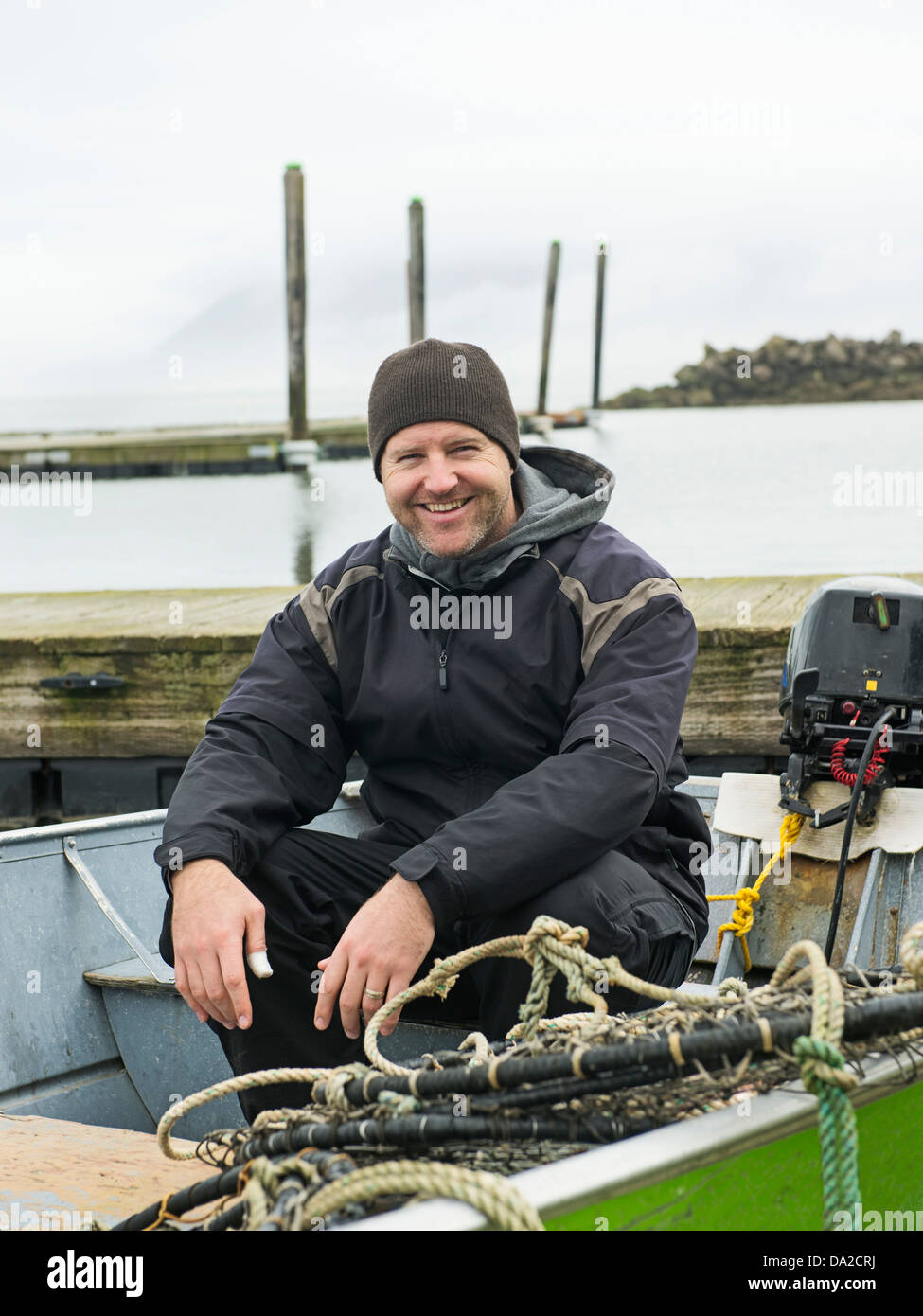 USA, Oregon, Rockaway Beach, Portrait of man in boat Stock Photo - Alamy