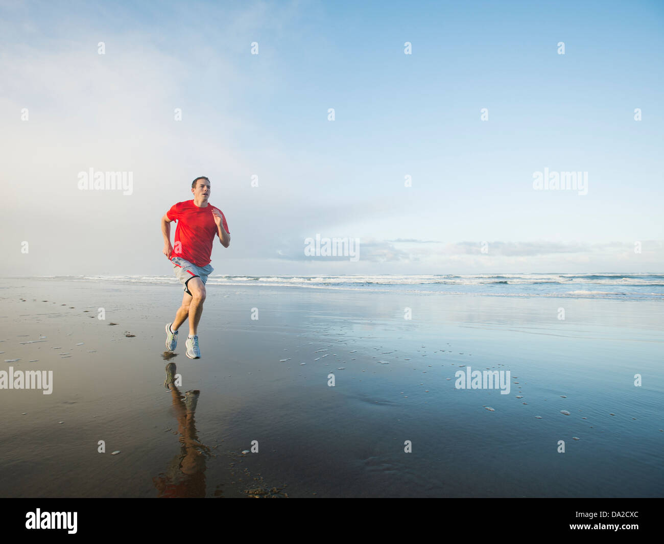 Young man running over hi-res stock photography and images - Alamy