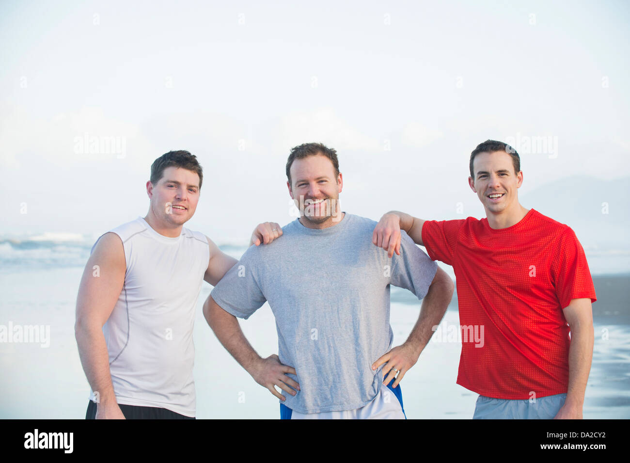 USA, Oregon, Rockaway Beach, Portrait of men on beach Stock Photo - Alamy