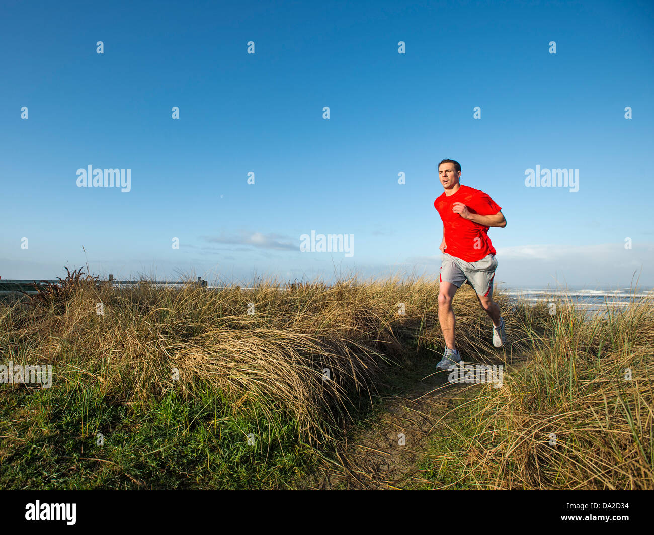 Young man running over hi-res stock photography and images - Alamy
