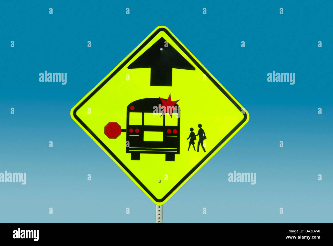 Warning sign against blue sky Stock Photo - Alamy