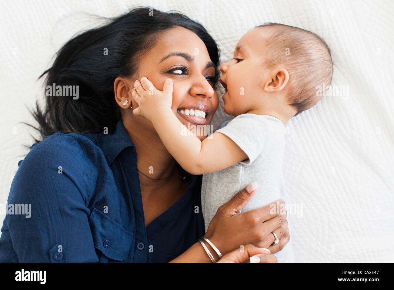 Indian son hugging mother hi-res stock photography and images - Alamy
