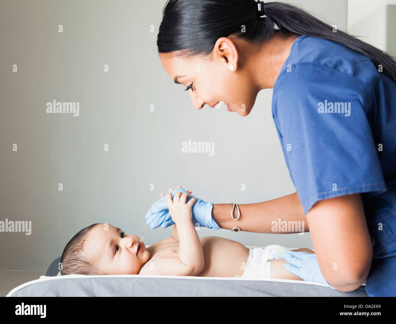 Nurse bending hi-res stock photography and images - Alamy