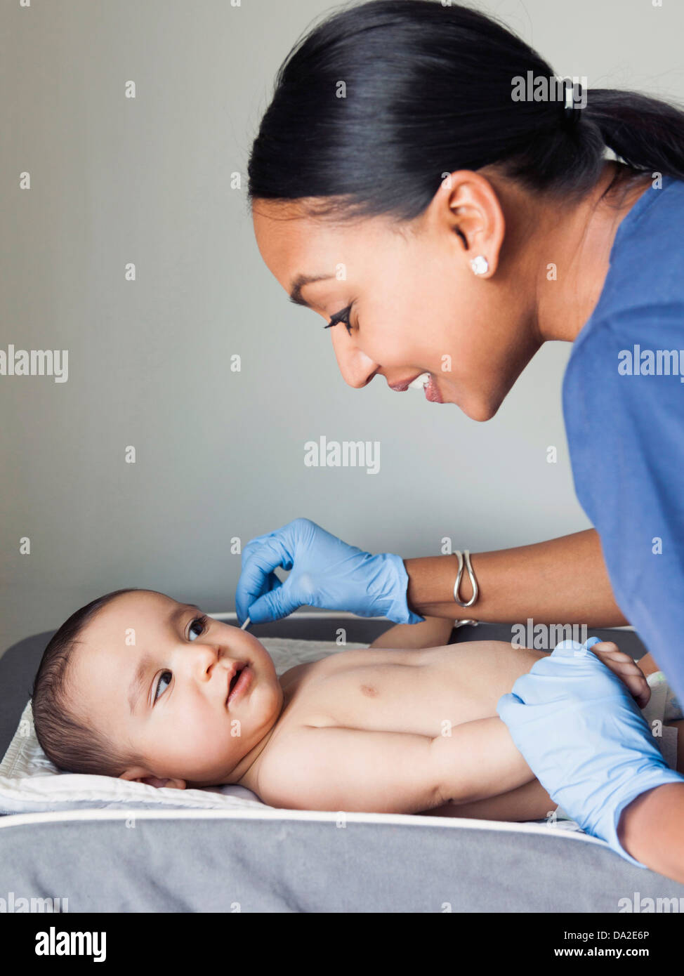 Baby ear cleaning hi-res stock photography and images - Alamy