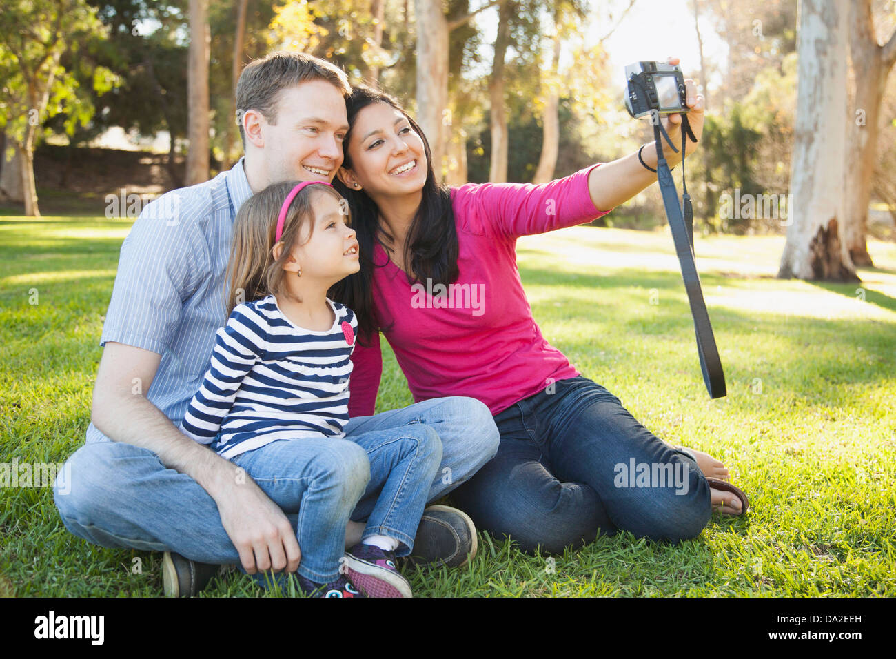 USA, California, Irvine, Family with daughter (4-5) playing in park and ...