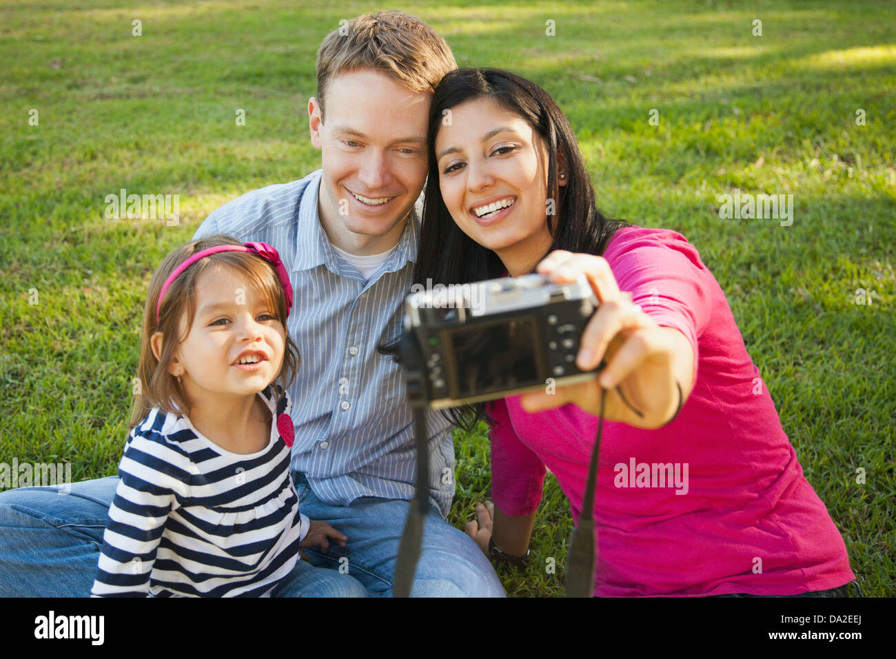 USA, California, Irvine, Family with daughter (4-5) playing in park and ...