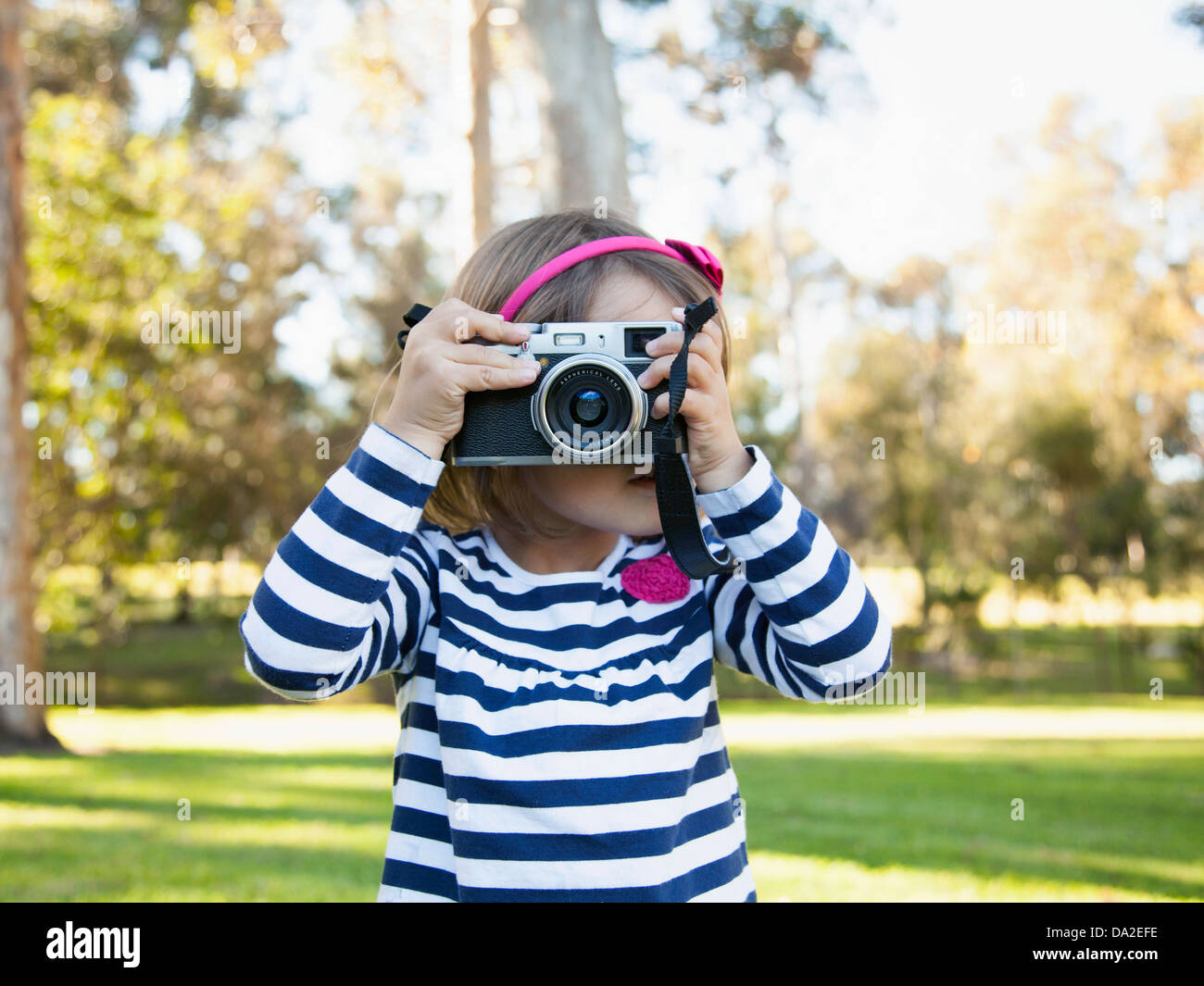 USA, California, Irvine, Girl (4-5) photographing in park Stock Photo ...