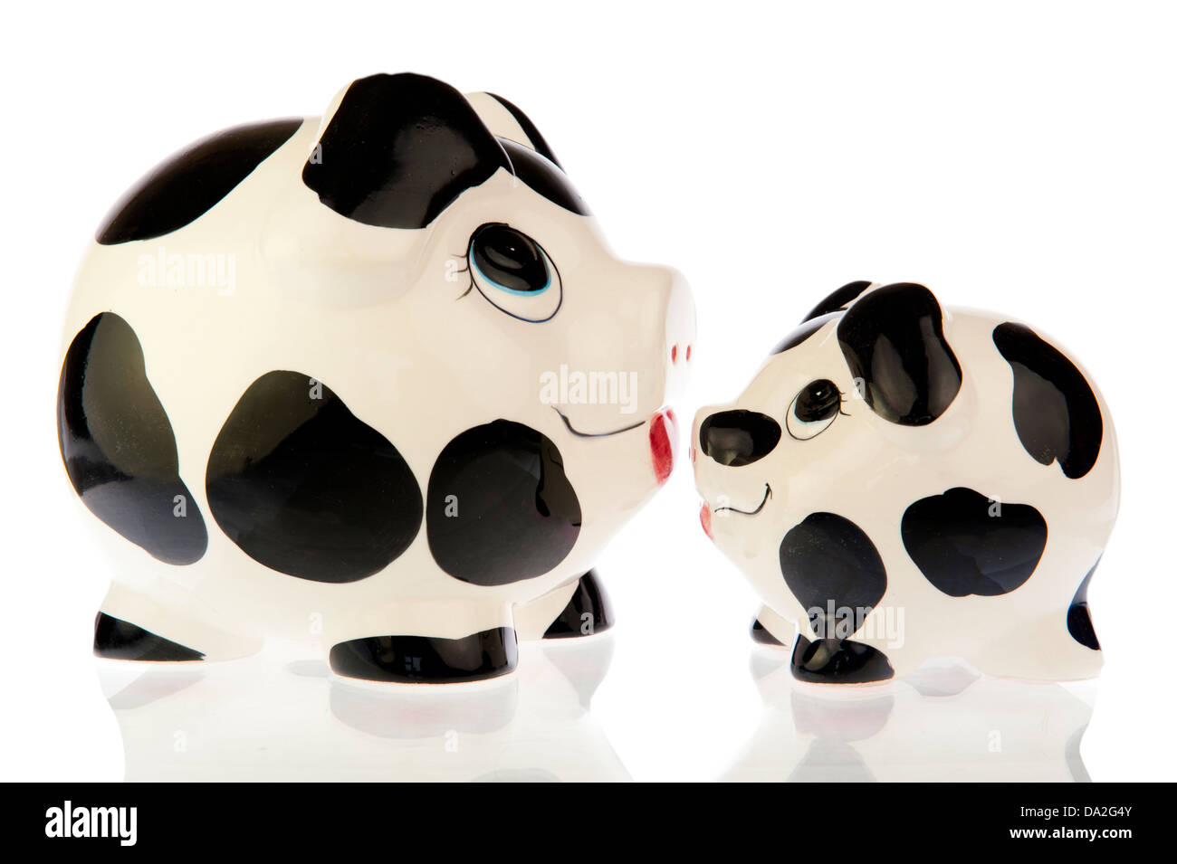 Two money saving pigs, mother and baby in black and white cow print ...