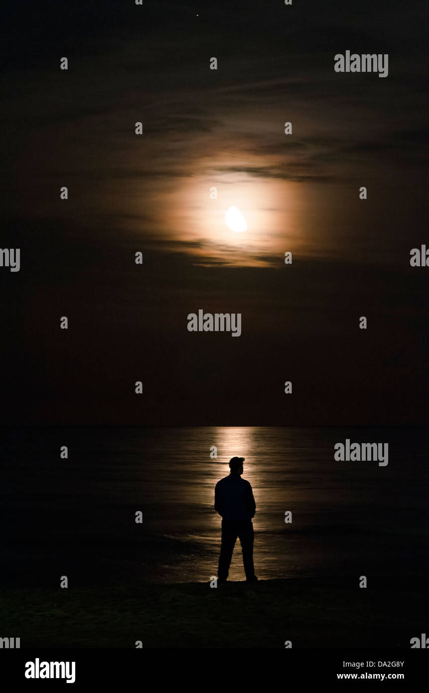 man and moon Stock Photo - Alamy