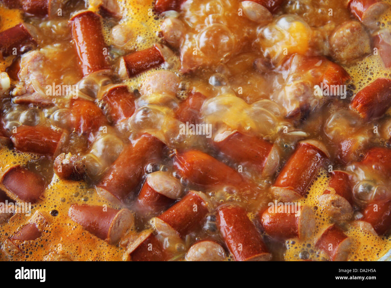 Surface of boiling stew with sausages Stock Photo - Alamy