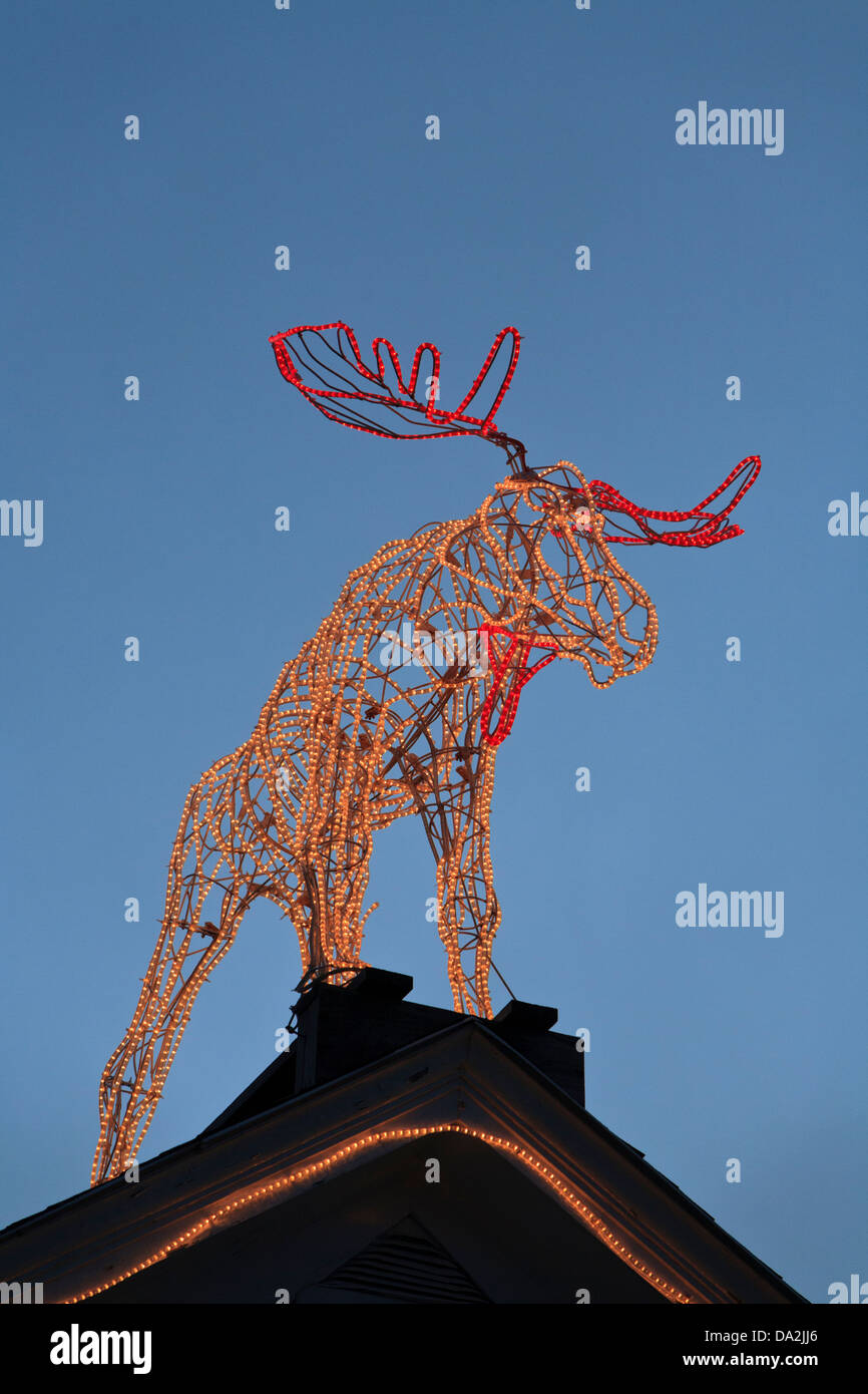 Wire-framed decorative moose on rooftop, Bar Harbor, Maine, at night ...
