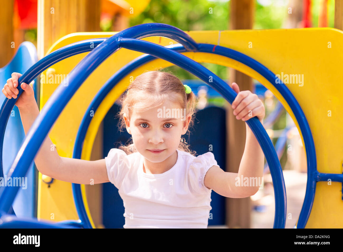Beautiful little girl on outdoor playground at summertime Stock Photo ...