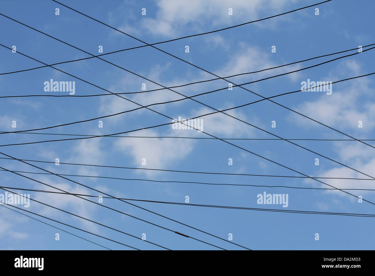 Blue sky, white clouds and electric wire, all over Stock Photo - Alamy