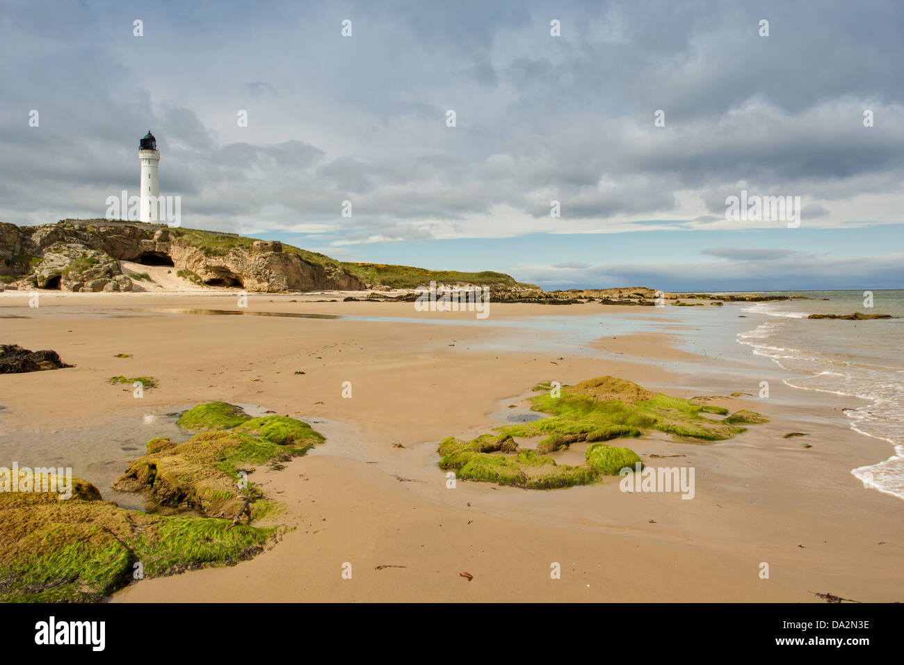 COVESEA SKERRIES LIGHTHOUSE ON THE ROCKS FROM THE BEACH NEAR ...