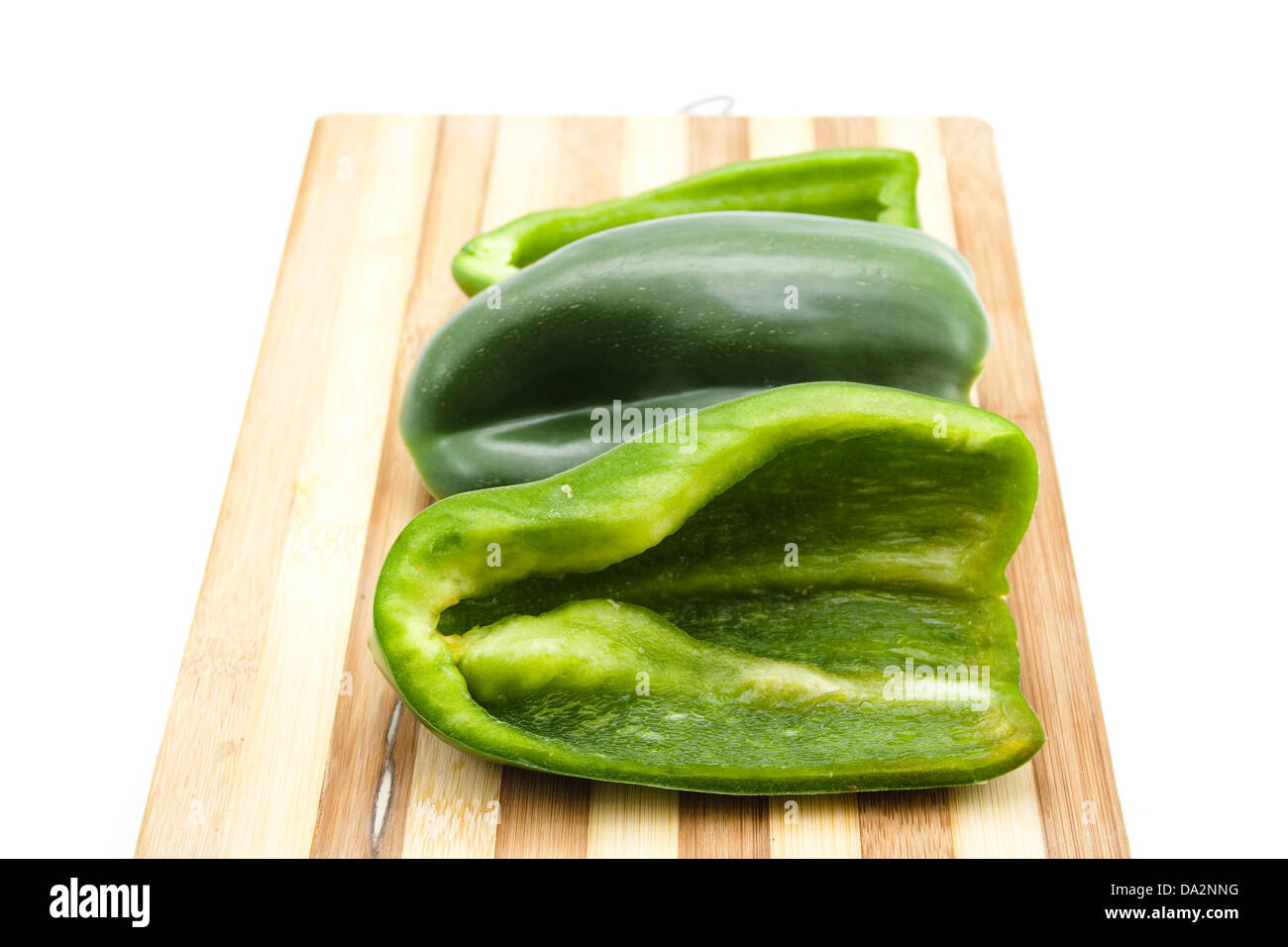 Fresh green capsicum on edge board Stock Photo - Alamy