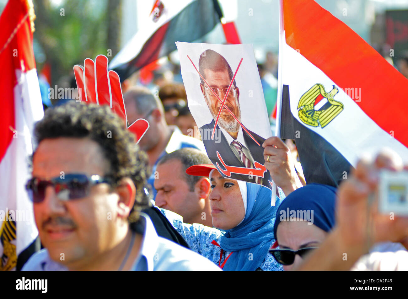Cairo, Egypt. 30th June, 2013. Protesters walk across Qasr al-Nil ...