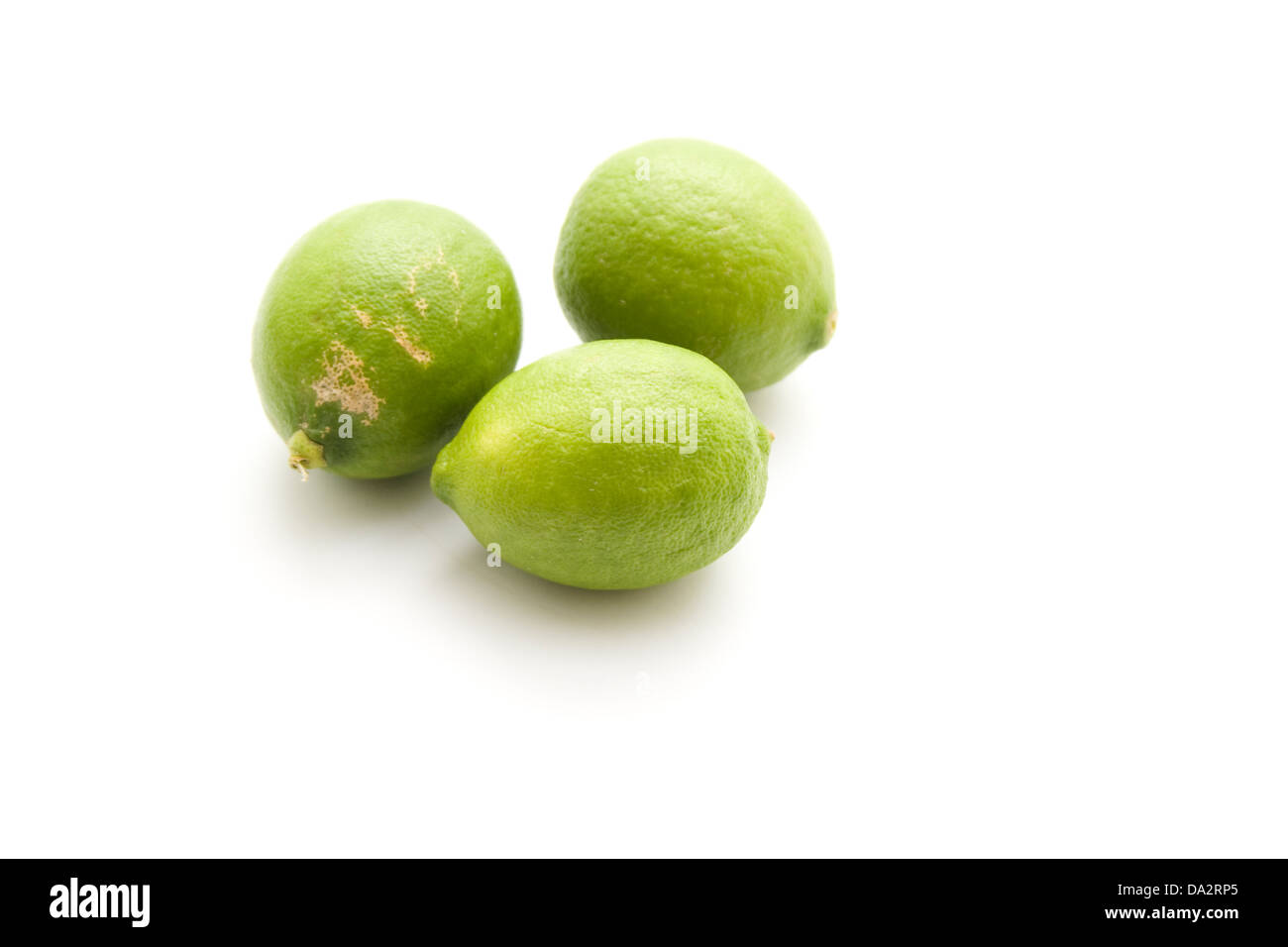 Fresh Green Lemon on white background Stock Photo - Alamy