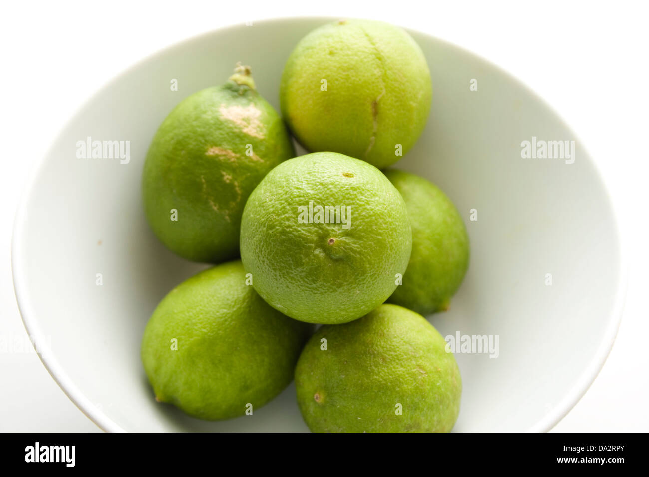 Fresh Green Lemon in bowl Stock Photo - Alamy