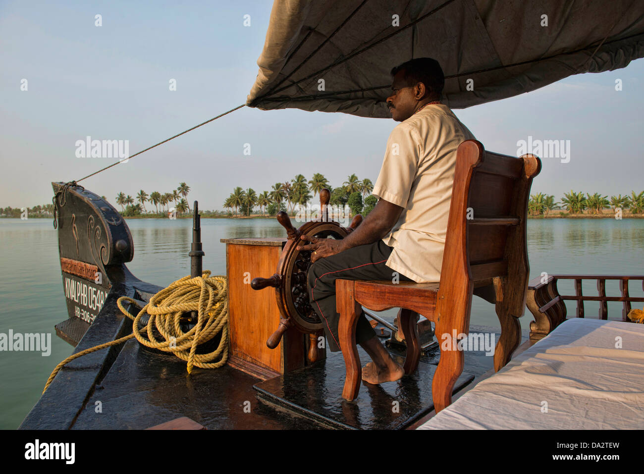houseboat captain on the backwaters of Kerala, India Stock Photo - Alamy