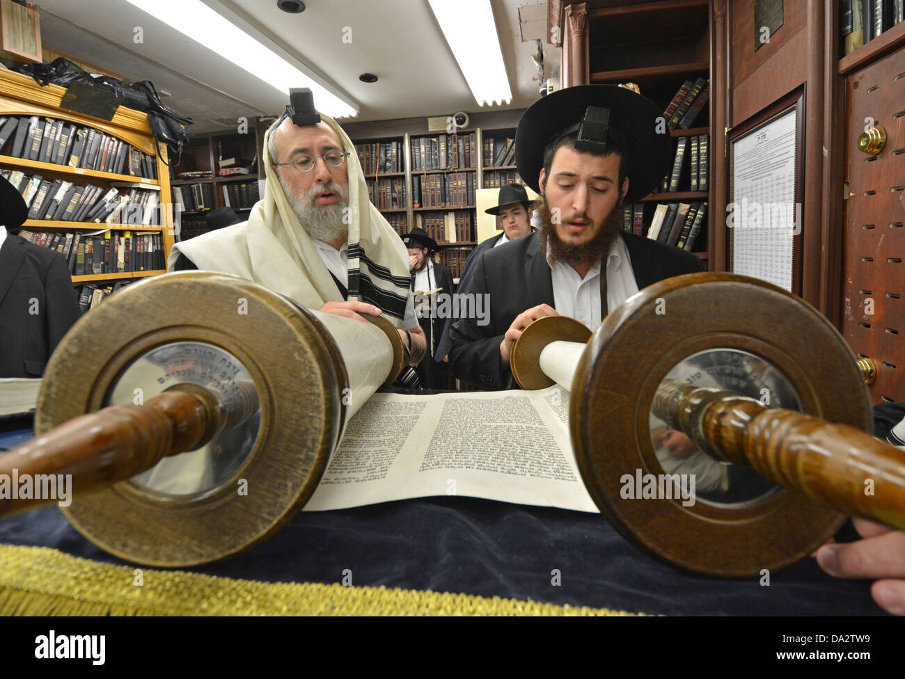 Rabbi is reading in torah at synagogue hi-res stock photography and ...