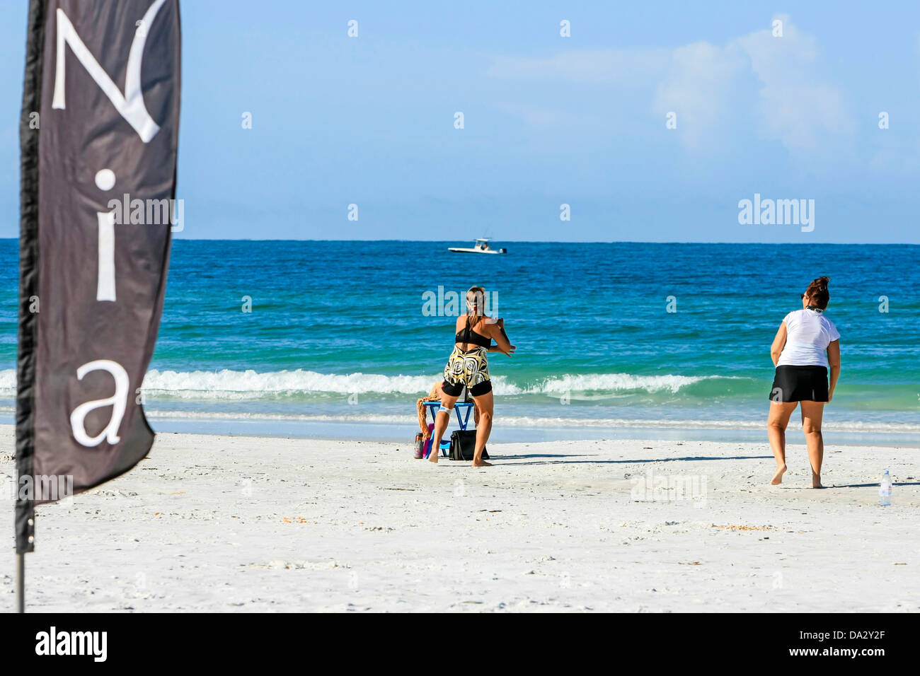 Women exercising the mind and body on the beach using the Nia technique ...