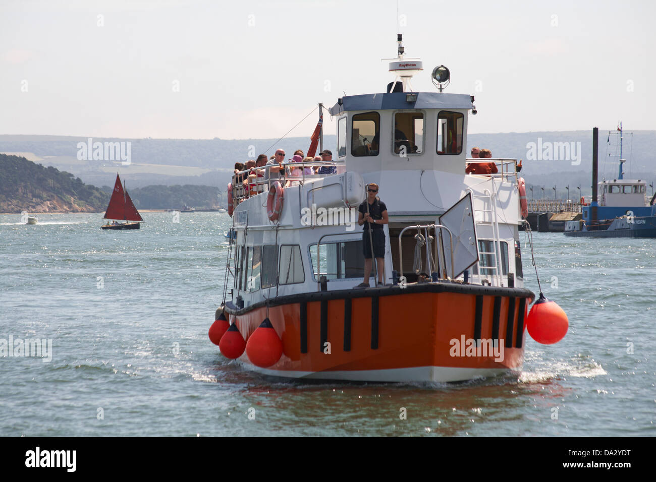 passengers returning from pleasure cruise trip at Poole harbour in June ...