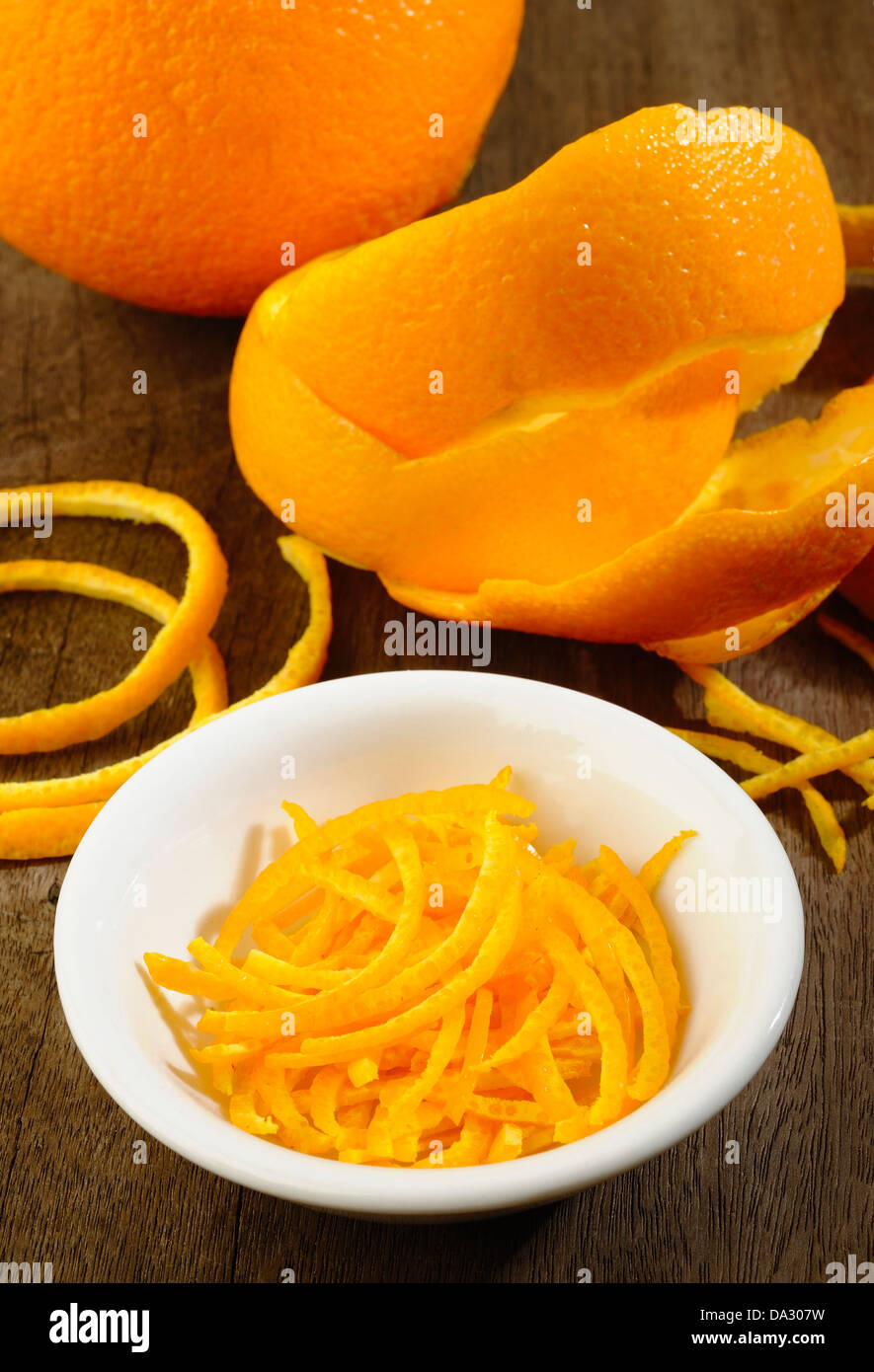 orange zest in white bowl Stock Photo - Alamy