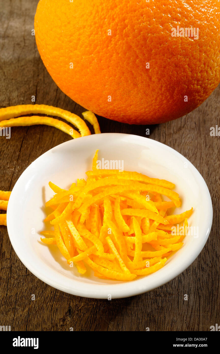 orange zest in white bowl Stock Photo - Alamy